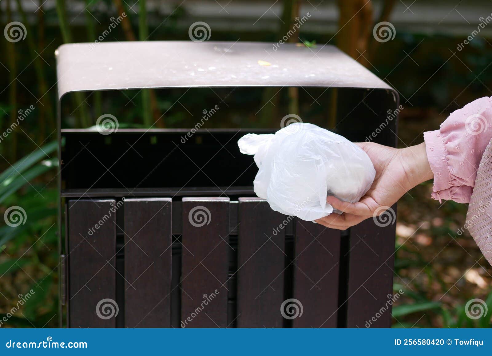 Women Hand Throwing an Empty Plastic Bag in the Garbage Trash or Bin ...
