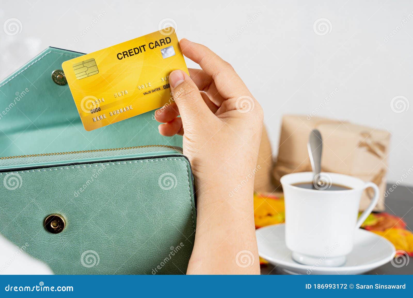 Women Hand Using a Yellow Credit Card, she Pulled the Card Out of Her ...