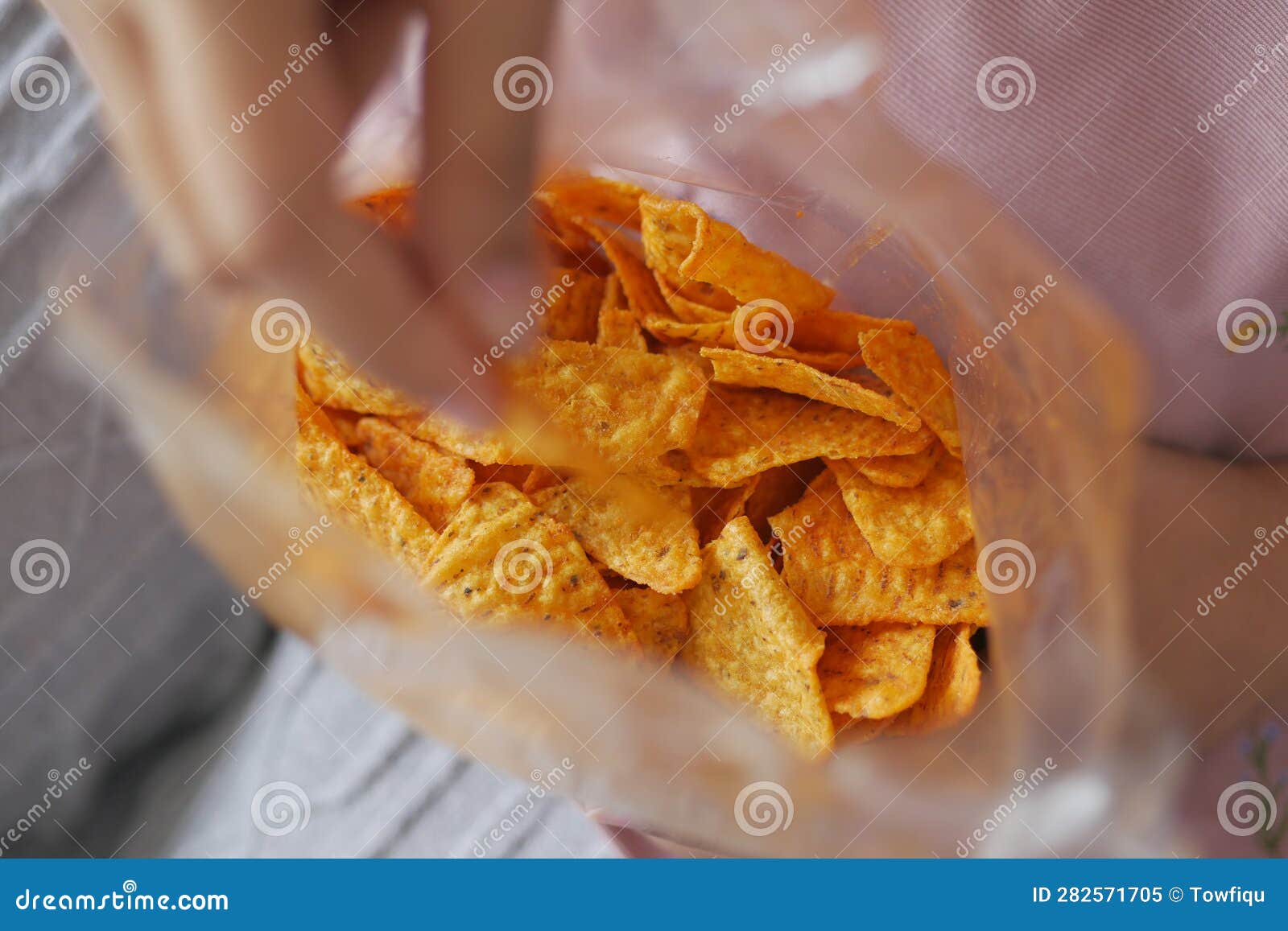 Women Holding a Open Potato Chips Packet Stock Image - Image of table ...