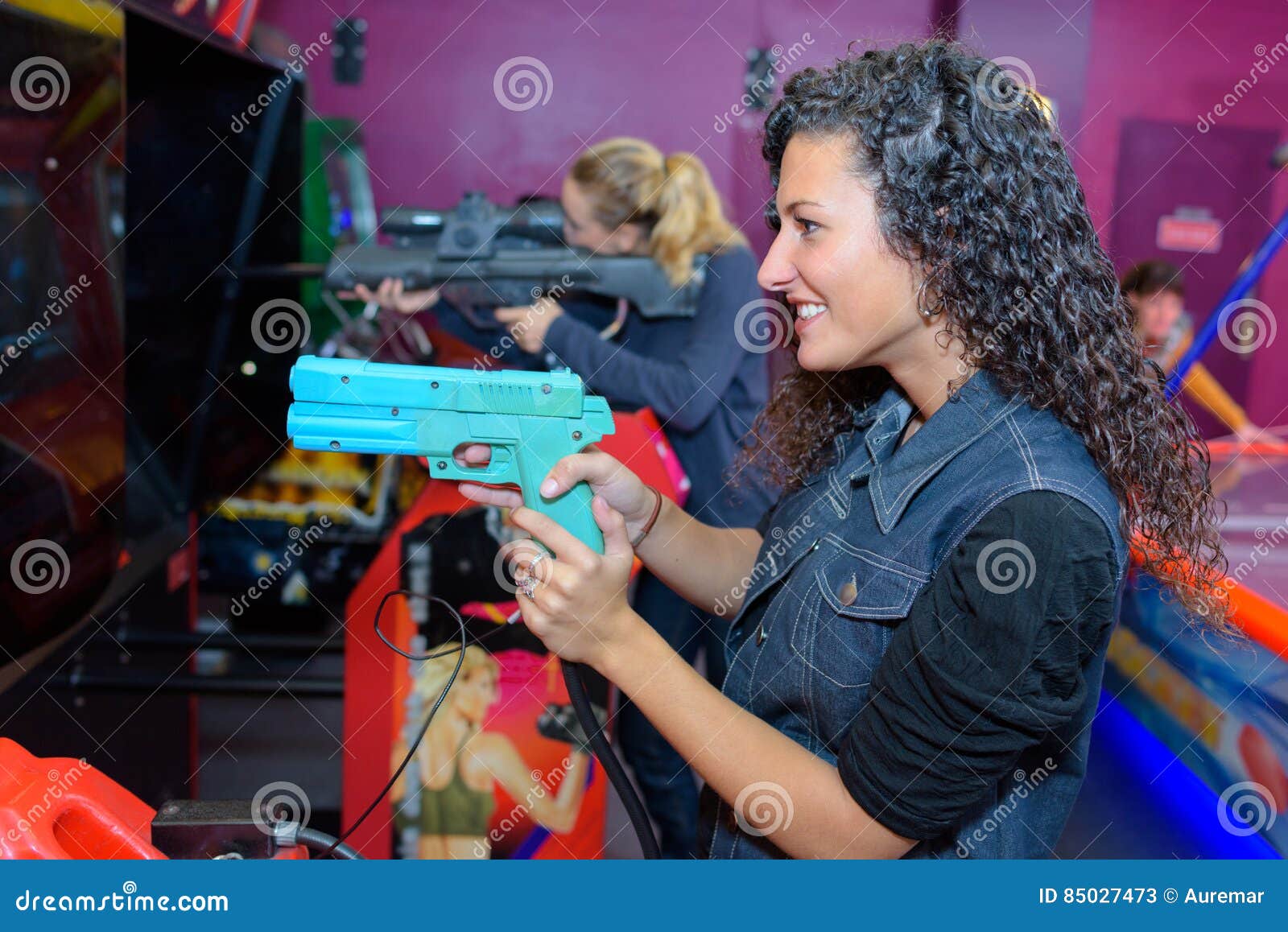 Women Holding Rifle Arcade Game Stock Image - Image of video, violence ...