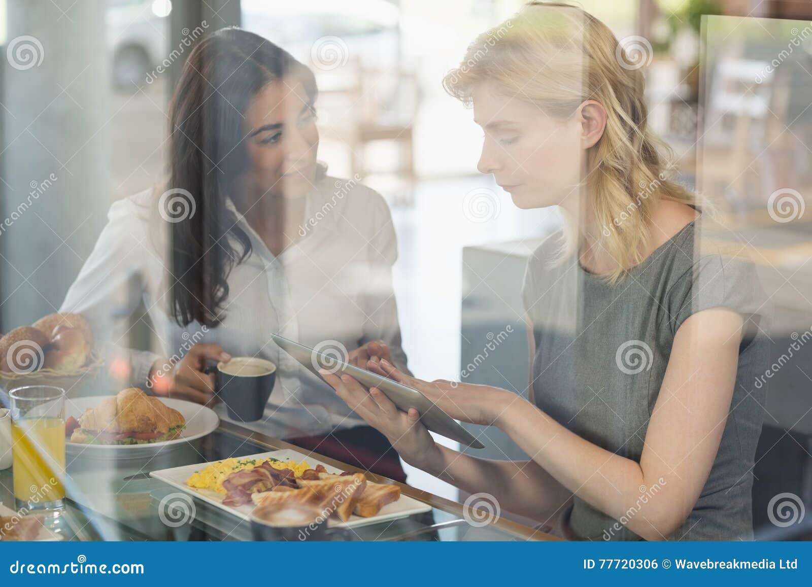 Women Interacting with Each Other while Using Digital Tablet Stock ...