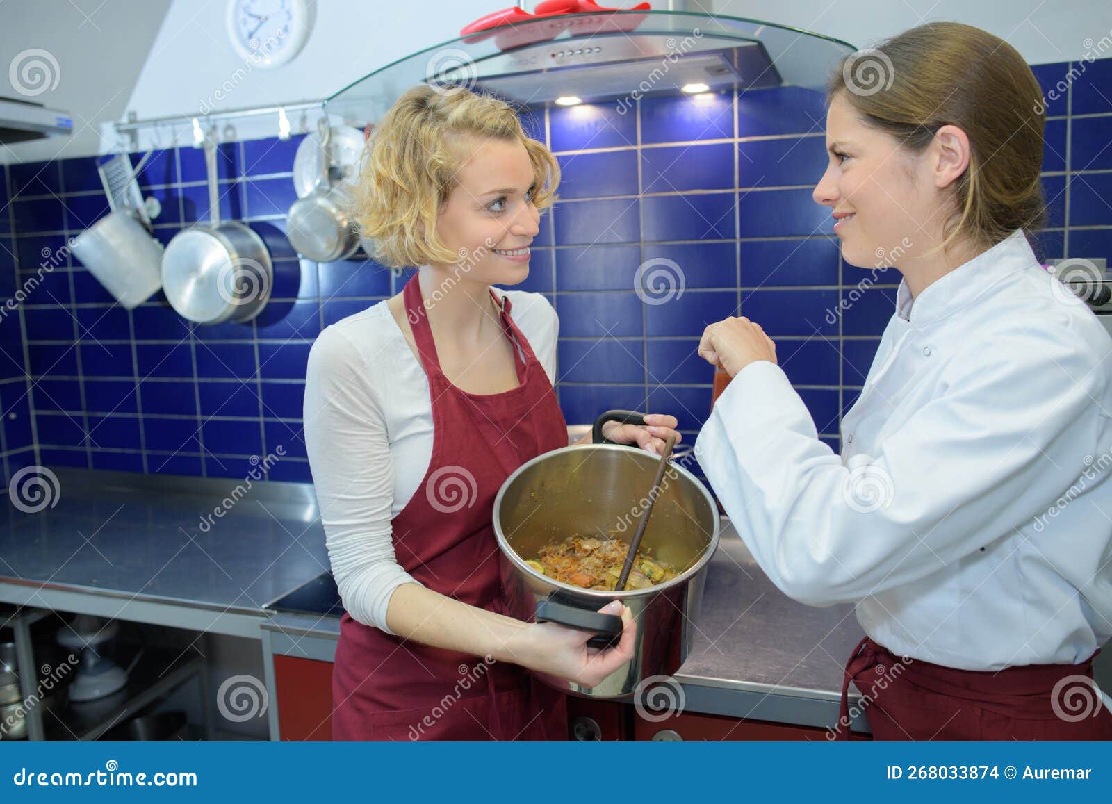 Women in kitchen tasting stock photo. Image of home - 268033874