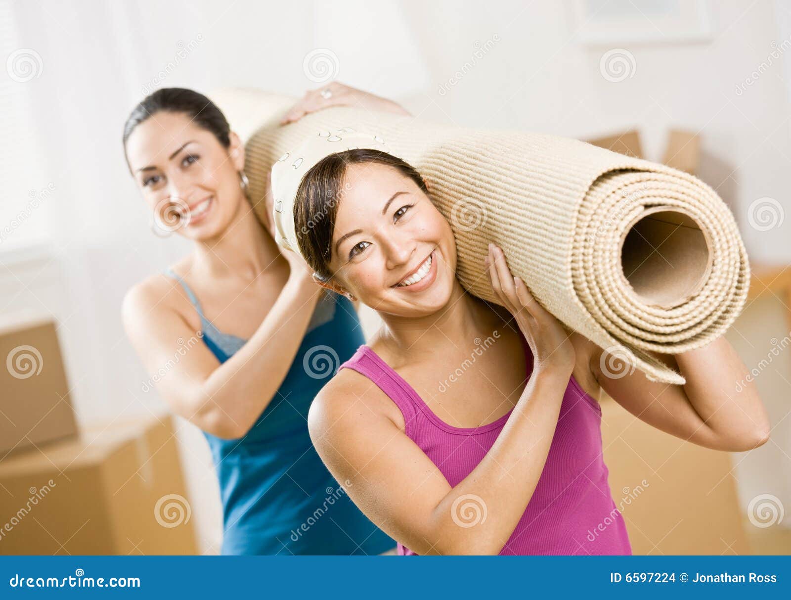 Women Moving into New Home and Carrying Rub Stock Photo - Image of ...