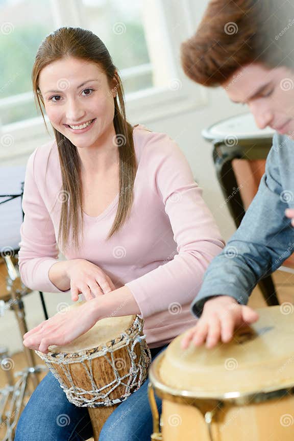 Women on percussion lesson stock photo. Image of hair - 326319692
