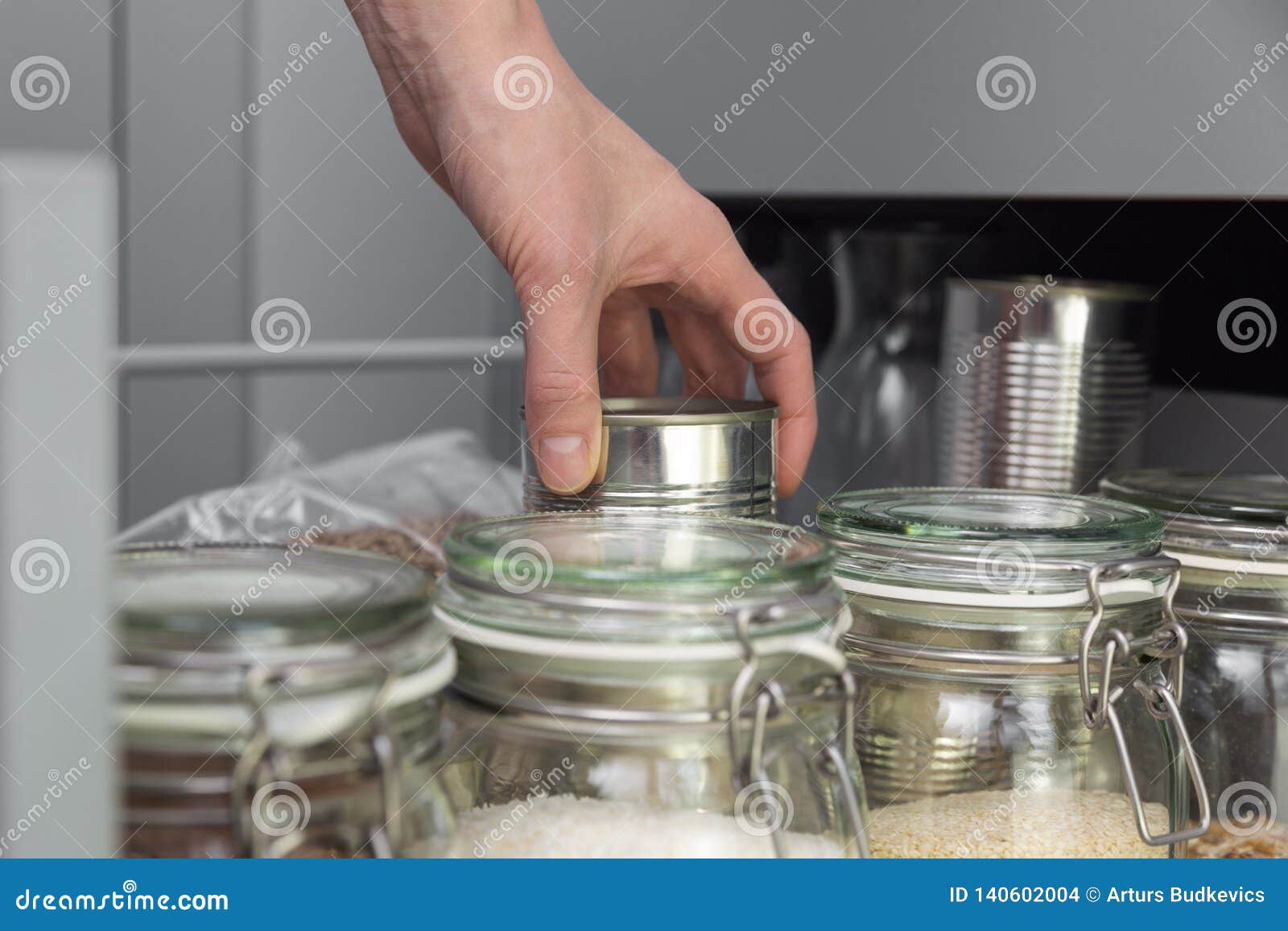 Women Picking an Item from Storage Hutch. Smart Kitchen Organization ...