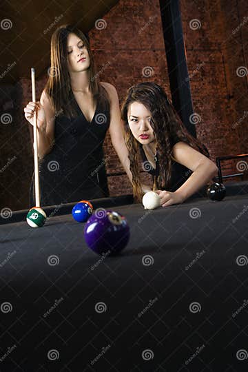 Women playing pool stock photo. Image of 080403c0147, aiming - 4997480