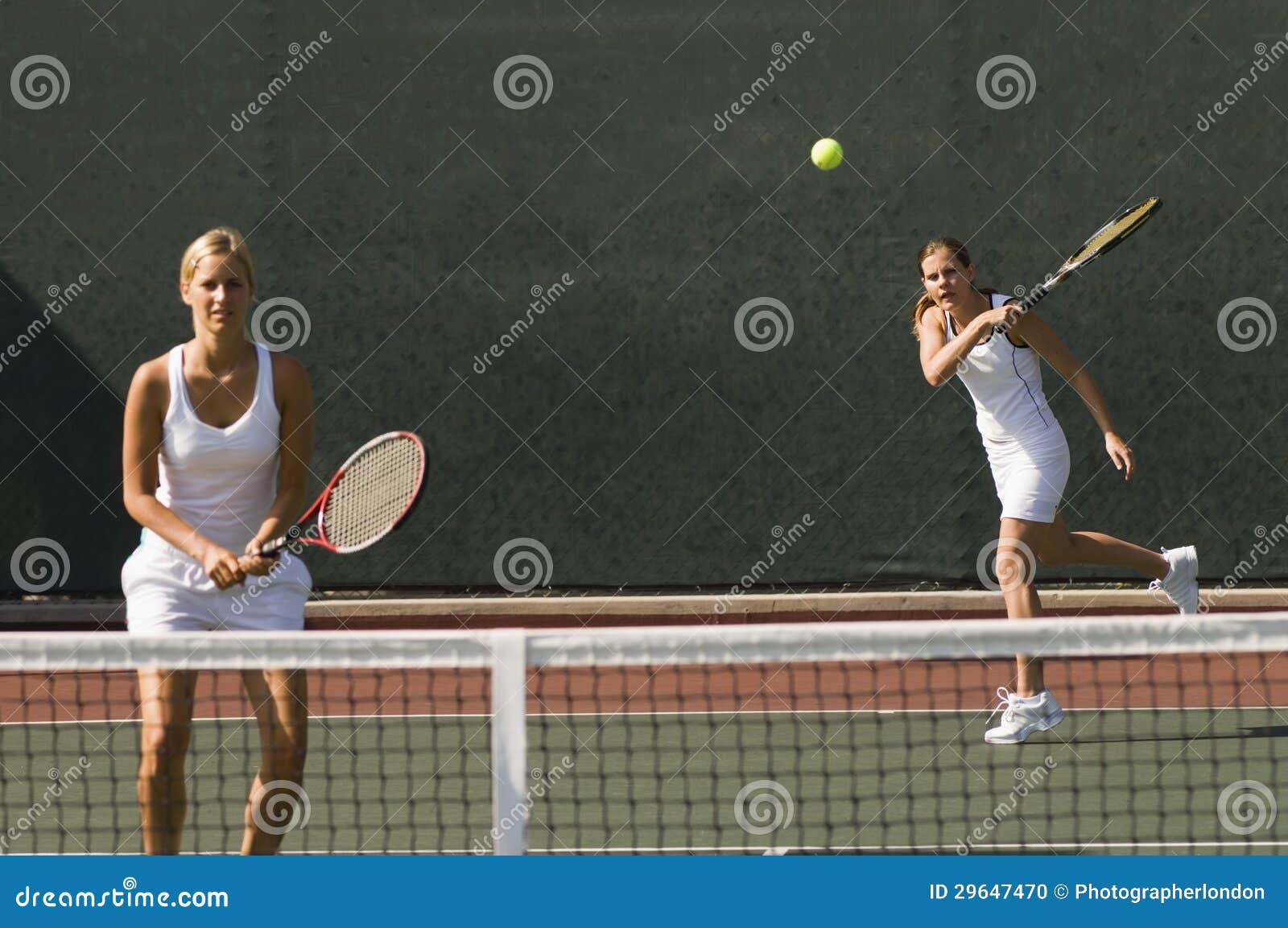 Women Playing Tennis stock photo. Image of activity, midair - 29647470