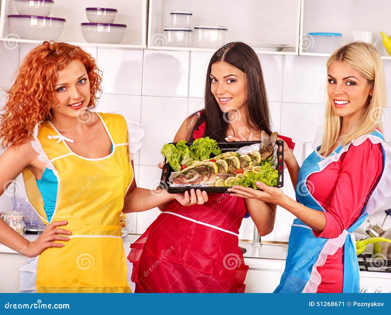 Women prepare fish in oven stock image. Image of frying - 51268671