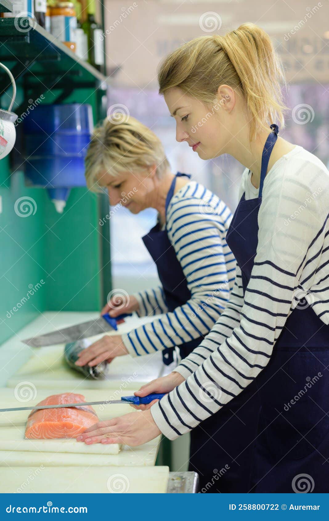 Women preparing the fish stock photo. Image of cooking - 258800722