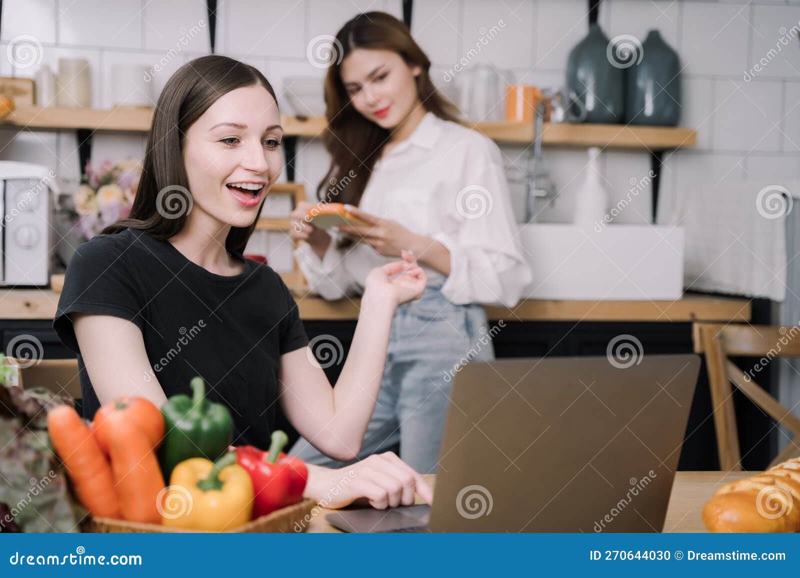 Women Preparing Food Playing with Vegetables and Bread in Kitchen ...