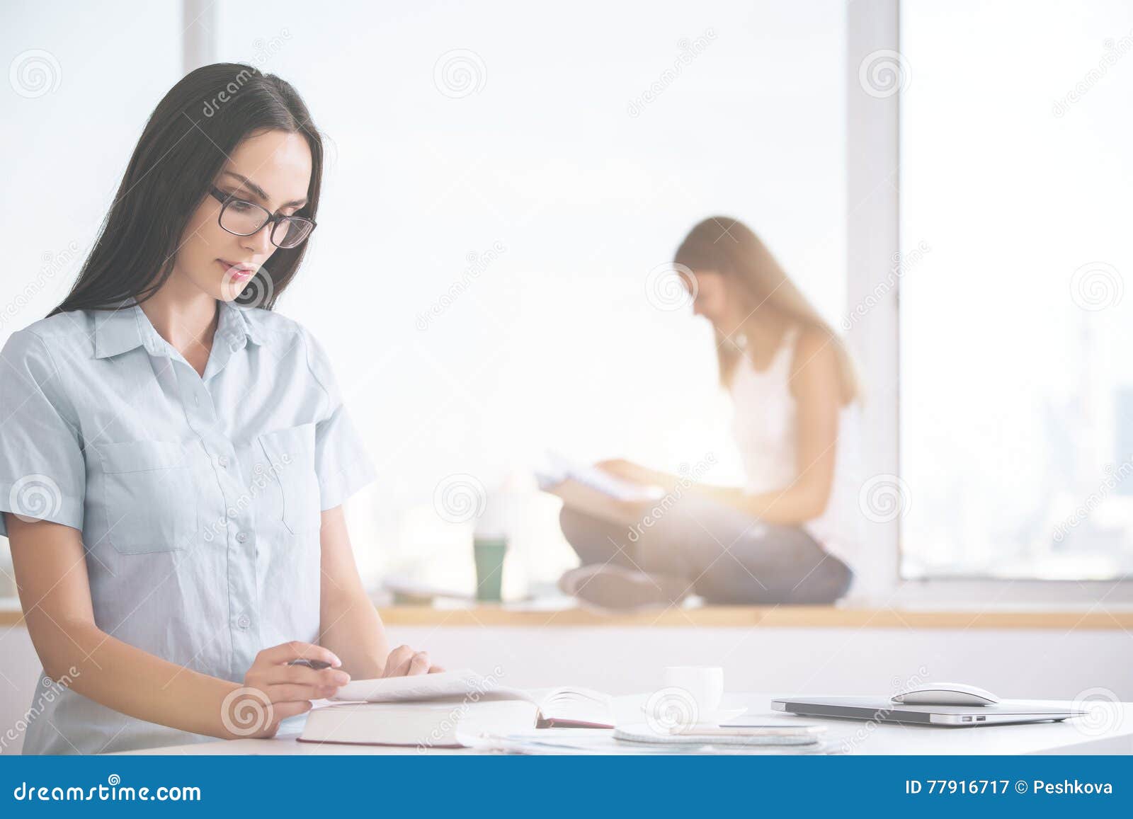 Women reading in office stock image. Image of laptop - 77916717