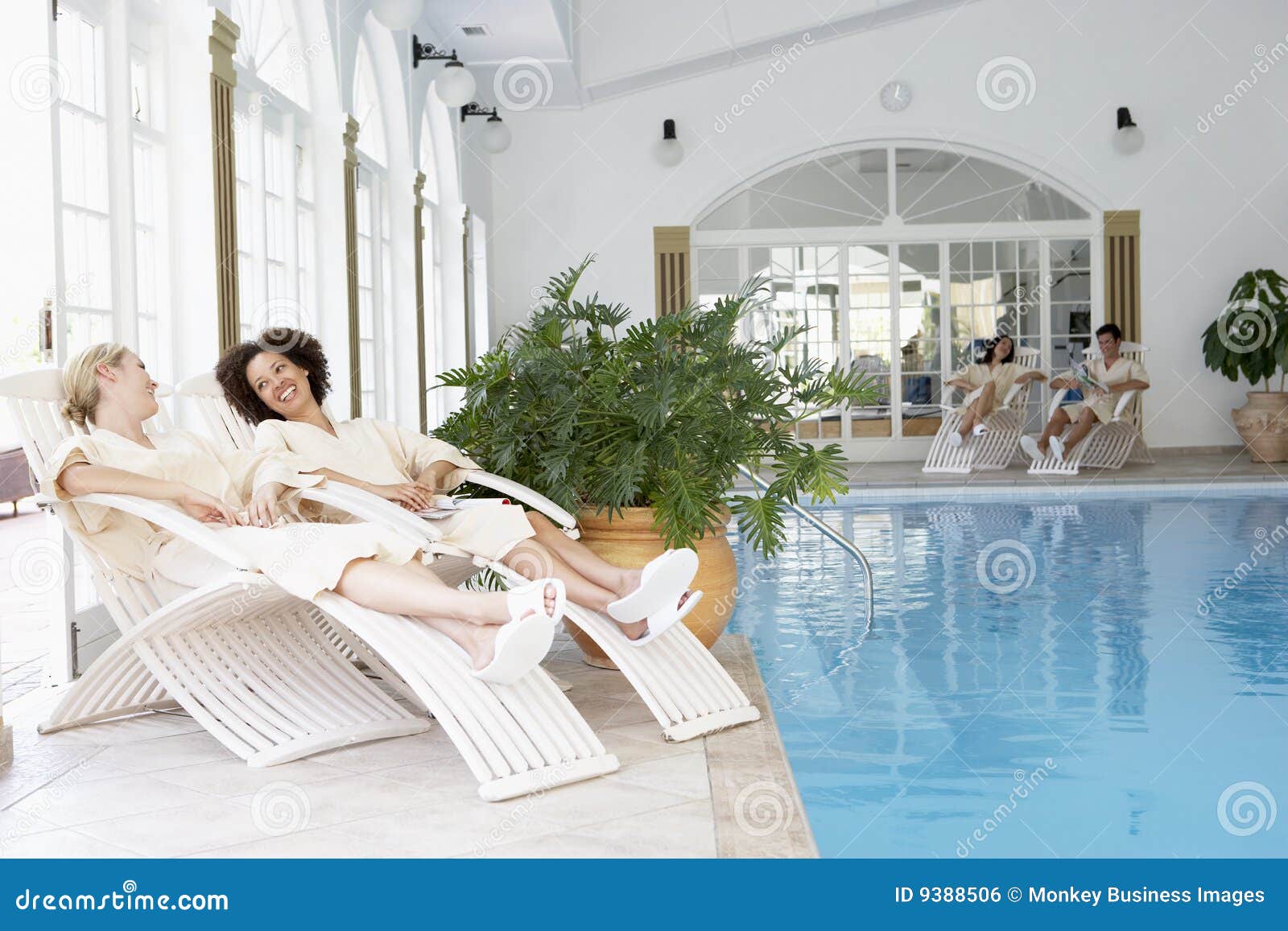 Women Relaxing Around Pool at Spa Stock Photo - Image of swimming ...