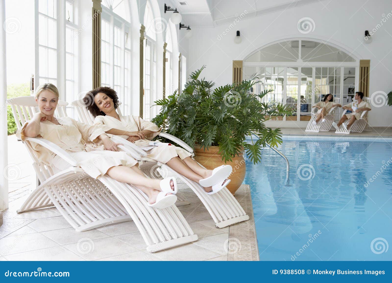 Women Relaxing Around Pool at Spa Stock Photo - Image of pretty ...