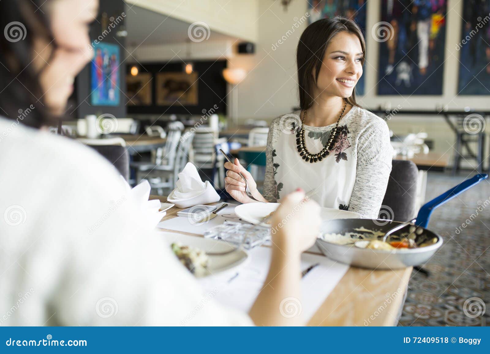 Women in the restaurant stock photo. Image of fork, eating - 72409518
