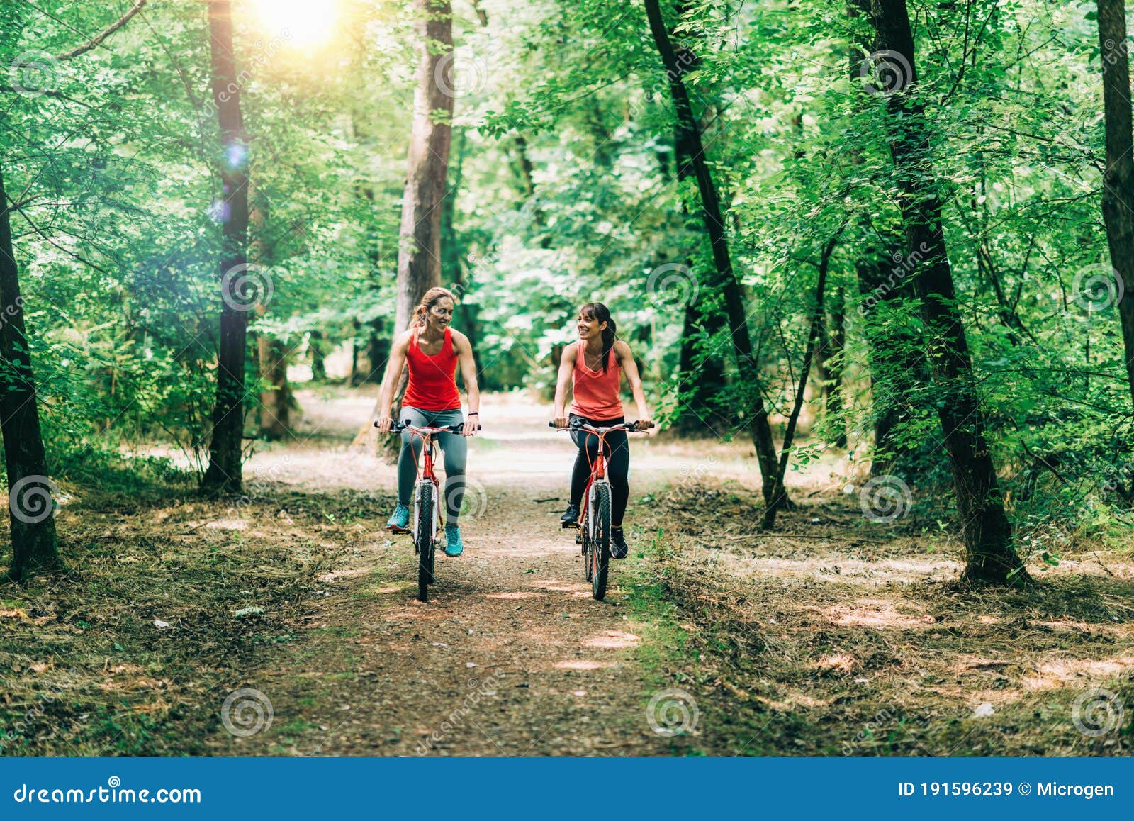 Women Riding Bikes Together Stock Image - Image of cycling, outdoor ...