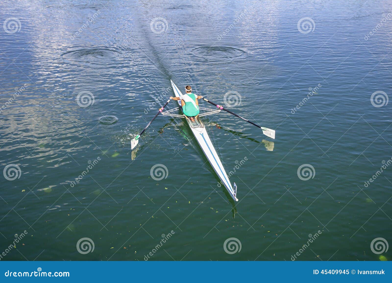 Women Rower in a boat stock image. Image of lake, oars - 45409945