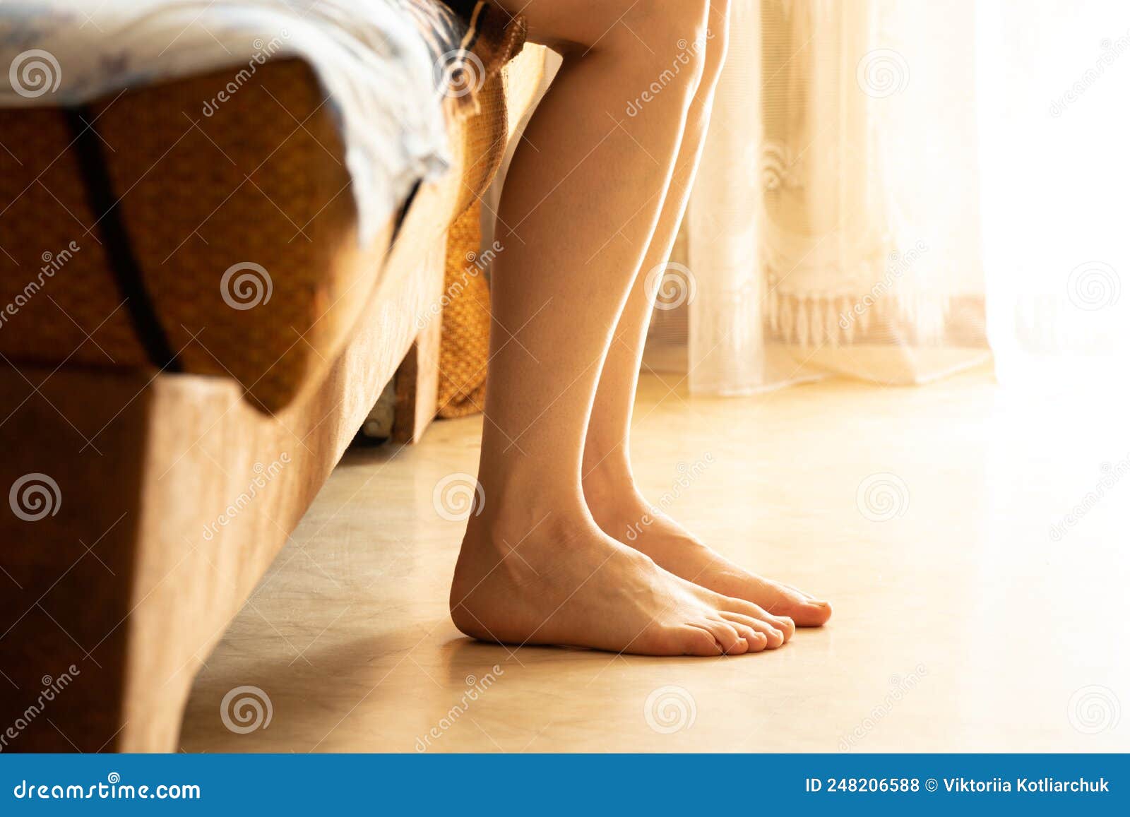 Womenand X27s Bare Feet On The Floor Near The Sofa In The Sun Bare Feet On The Floor Sit On The