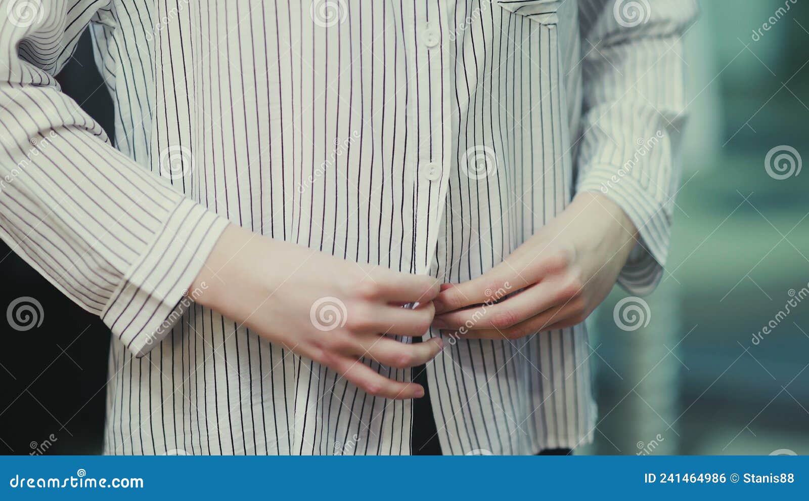 Women& X27;s Hands are Buttoning Up the Buttons on a Striped Blouse ...