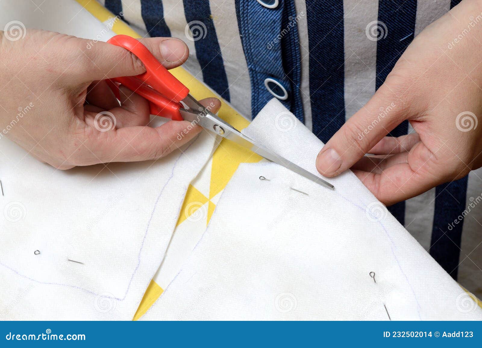 Women`s Hands Cut the Fabric with Scissors According To the Pattern on ...