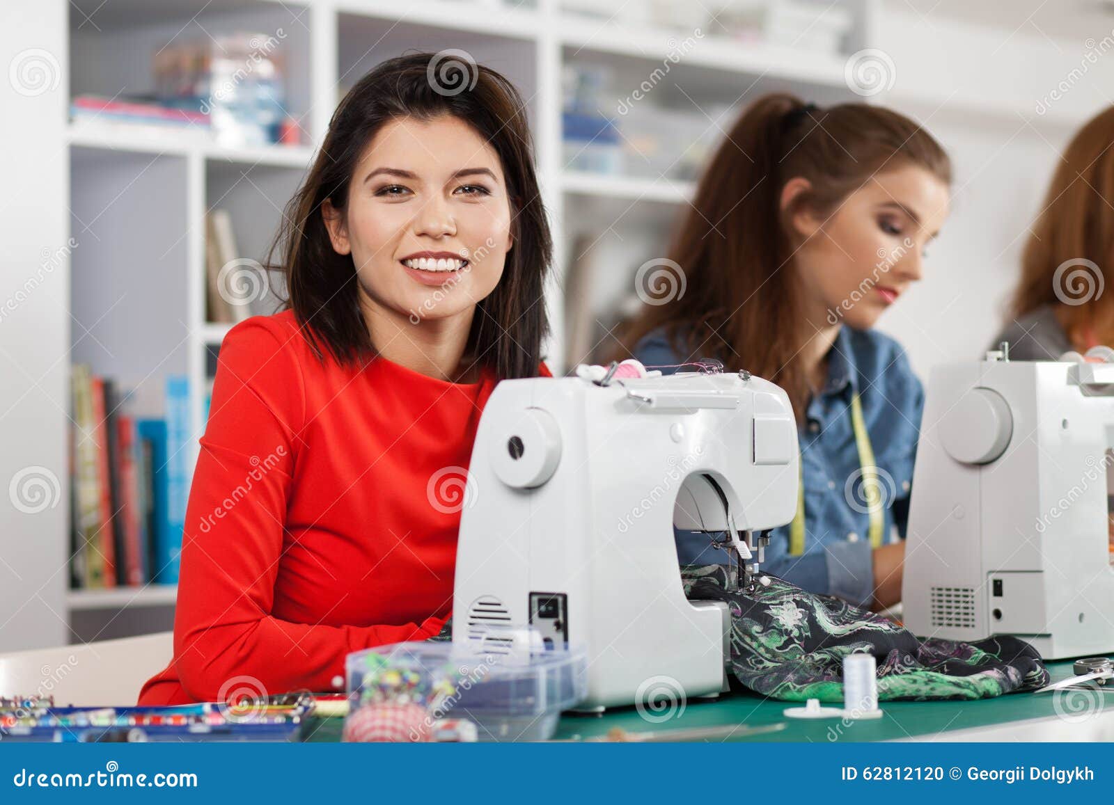 Women in a sewing workshop stock photo. Image of dressmaker - 62812120