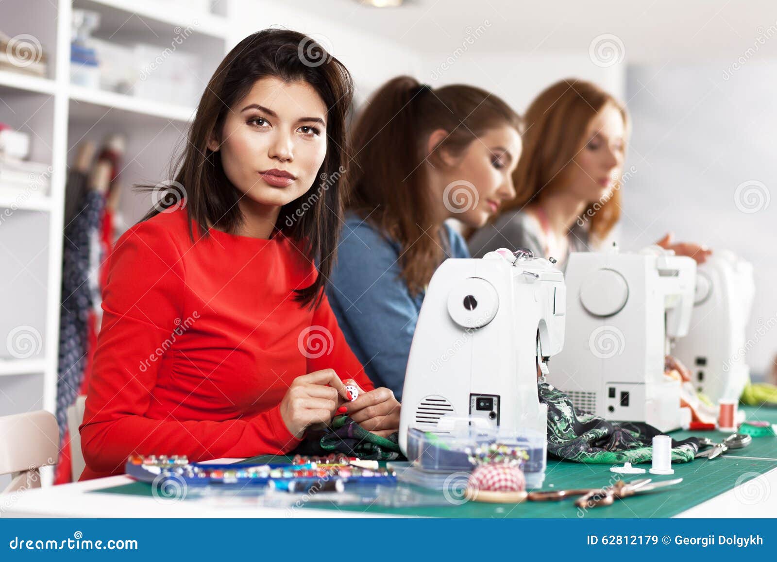 Women in a sewing workshop stock image. Image of occupation - 62812179