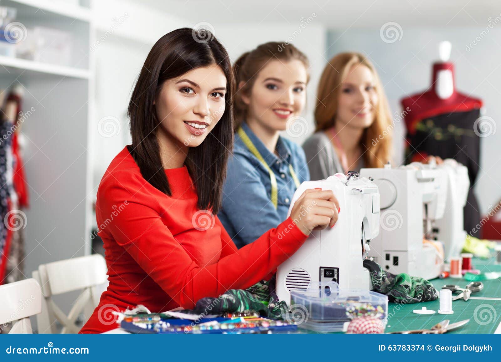 Women in a sewing workshop stock photo. Image of fashion - 63783374