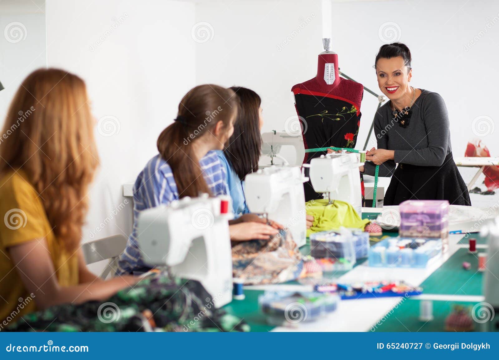 Women in a sewing workshop stock image. Image of machine - 65240727