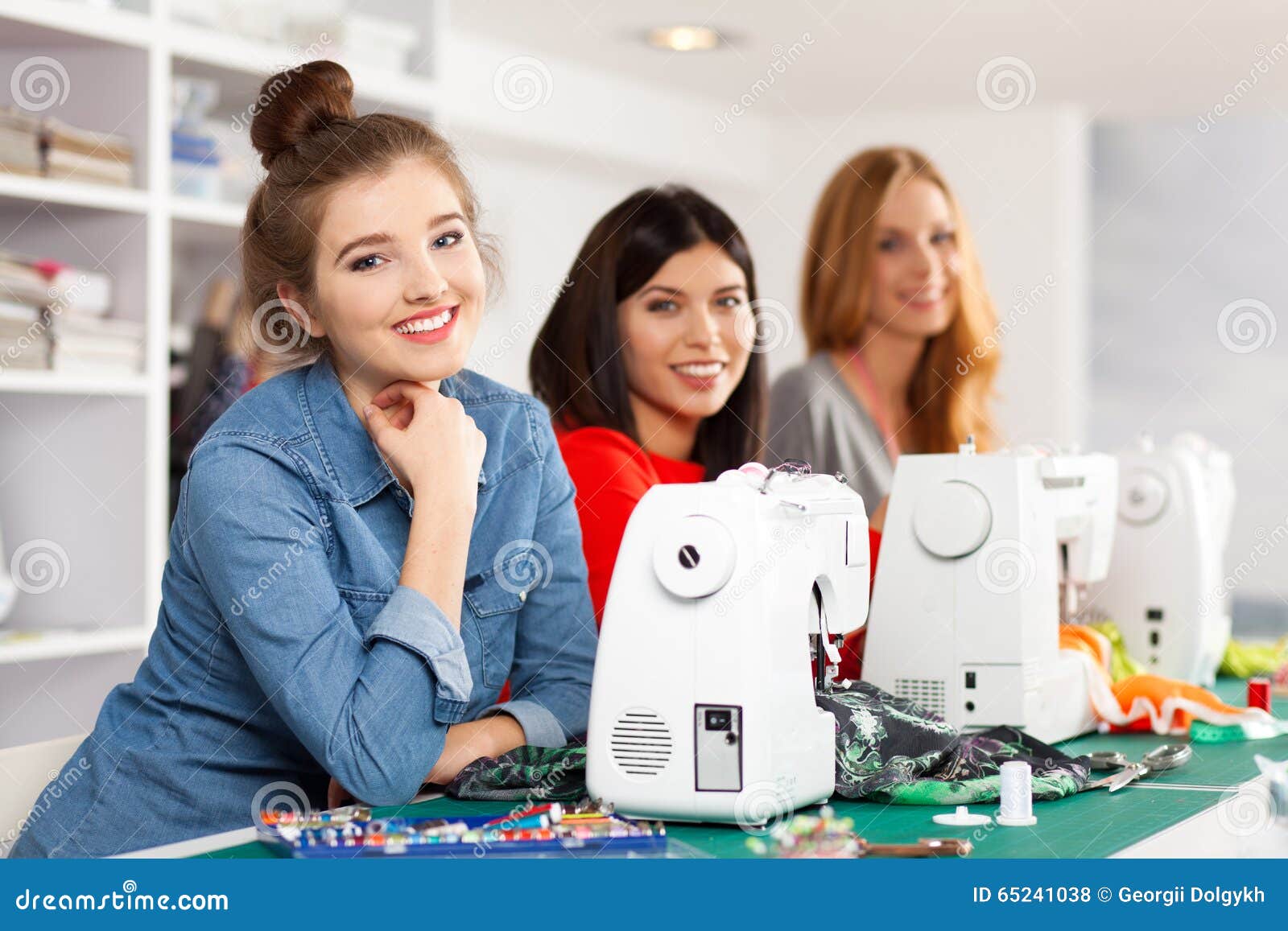 Women in a sewing workshop stock photo. Image of creative - 65241038