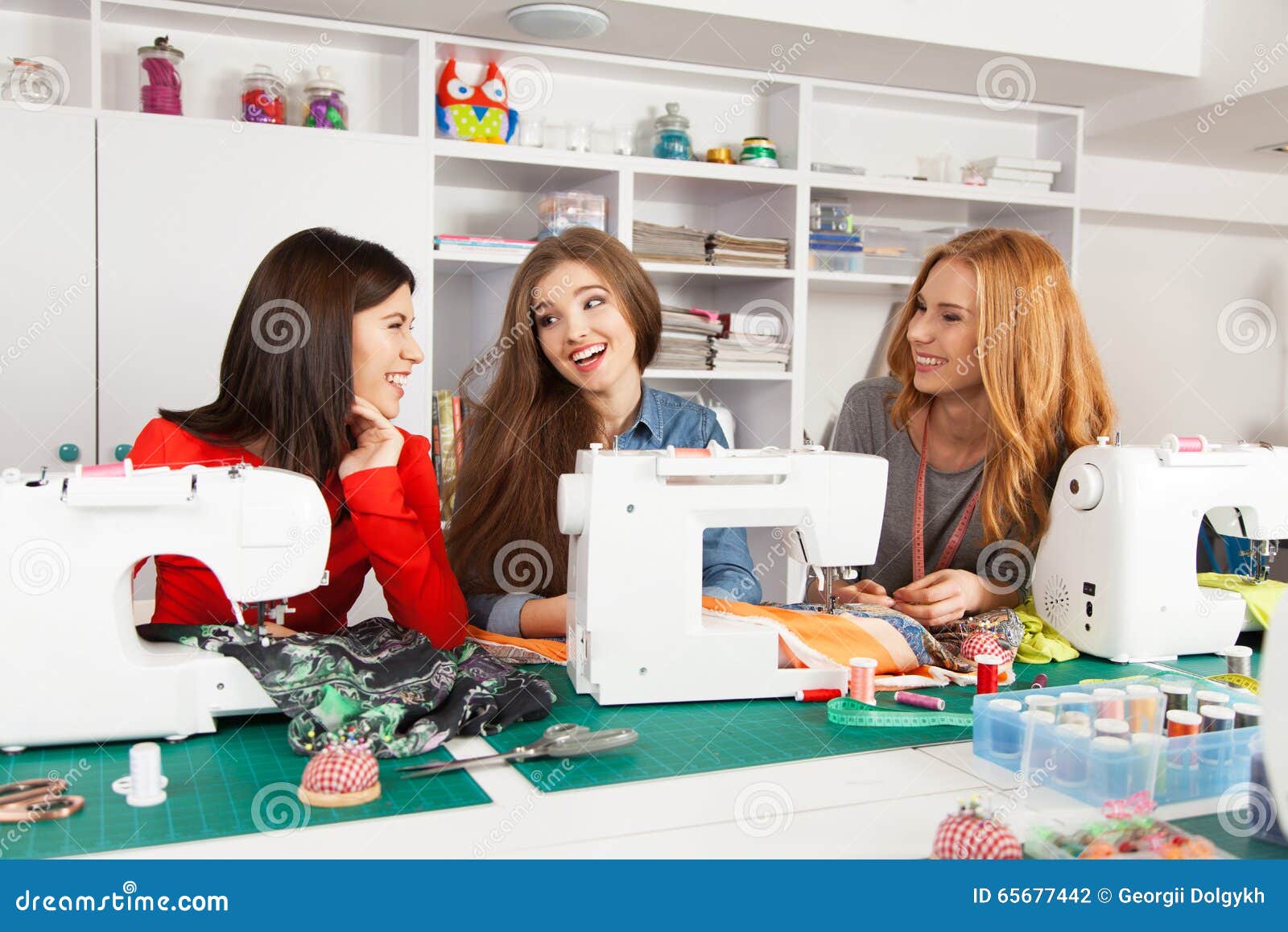 Women in a sewing workshop stock photo. Image of girl - 65677442