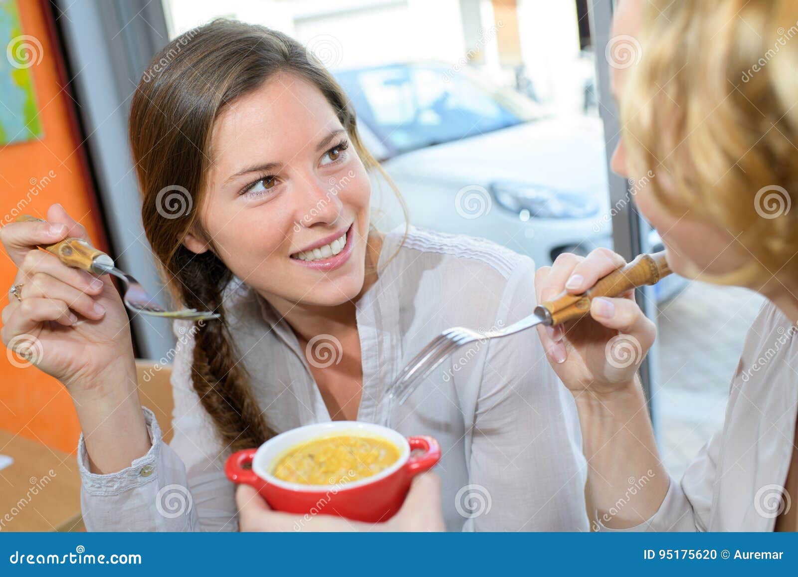 Women Sharing from Bowl Food Stock Photo - Image of happiness, brunette ...