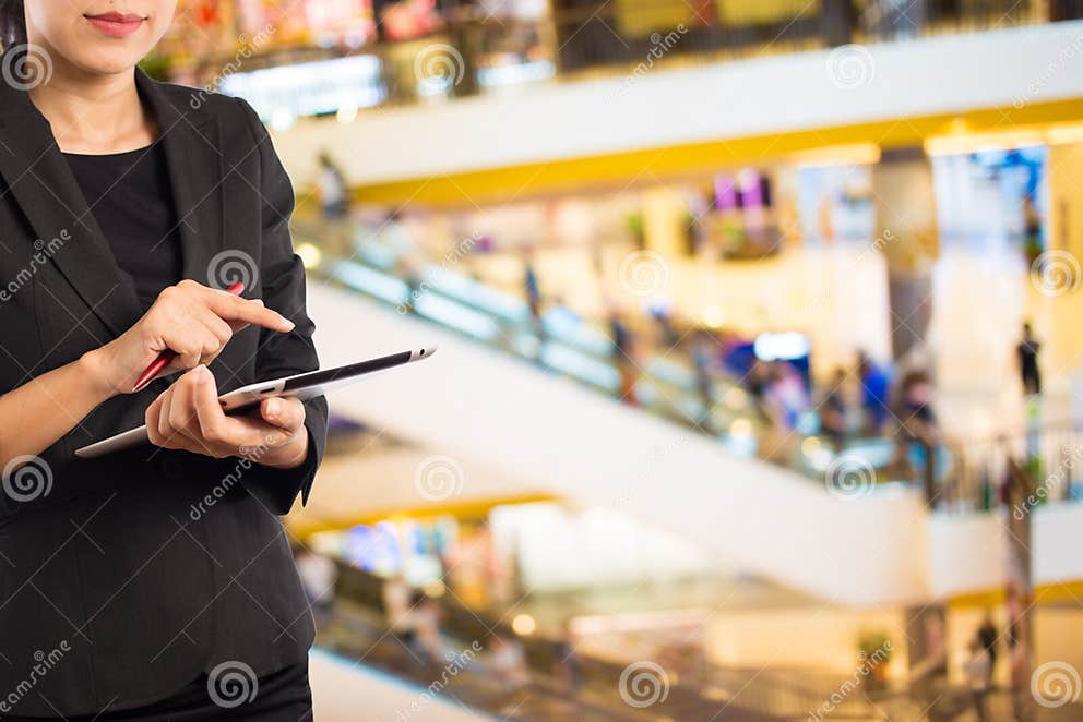 Women in Shopping Mall Using Mobile Tablet PC. Stock Photo - Image of ...