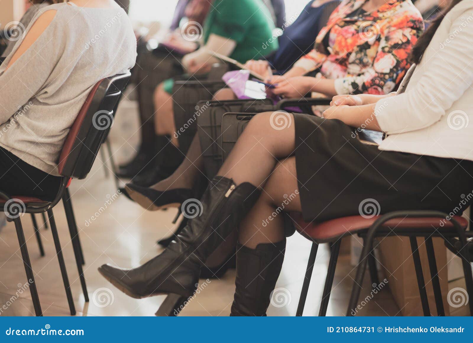 Women Sit in a Row at a Workshop Stock Image - Image of office ...