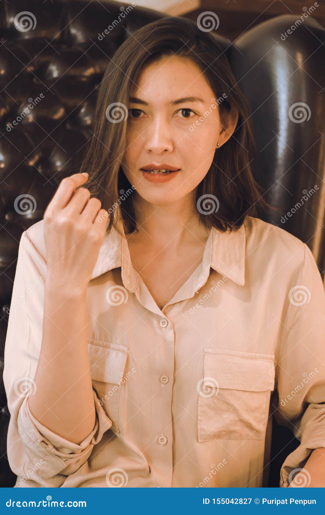 Women Sitting on a Black Leather Sofa Stock Image - Image of long ...