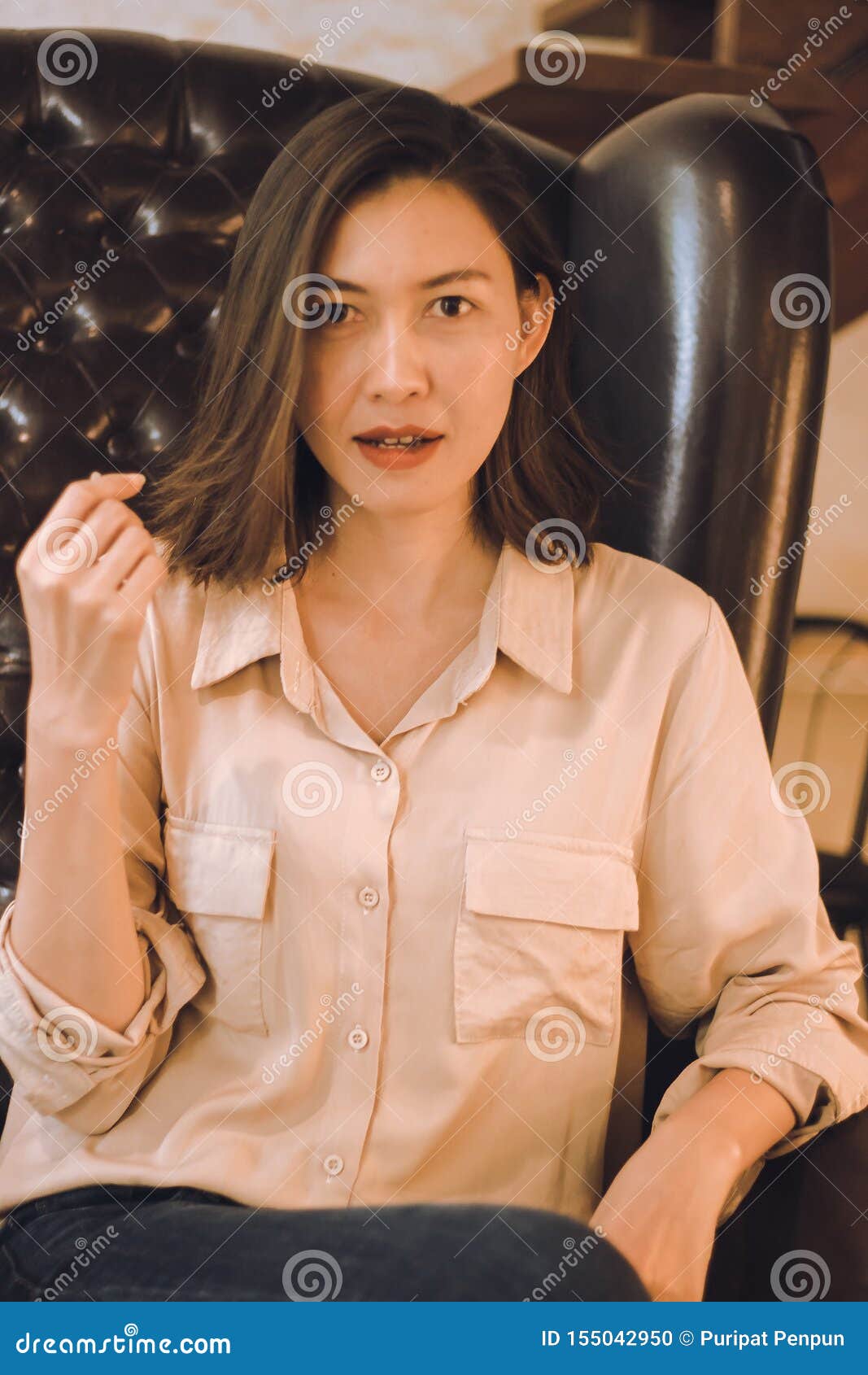 Women Sitting on a Black Leather Sofa Stock Photo - Image of indoors ...