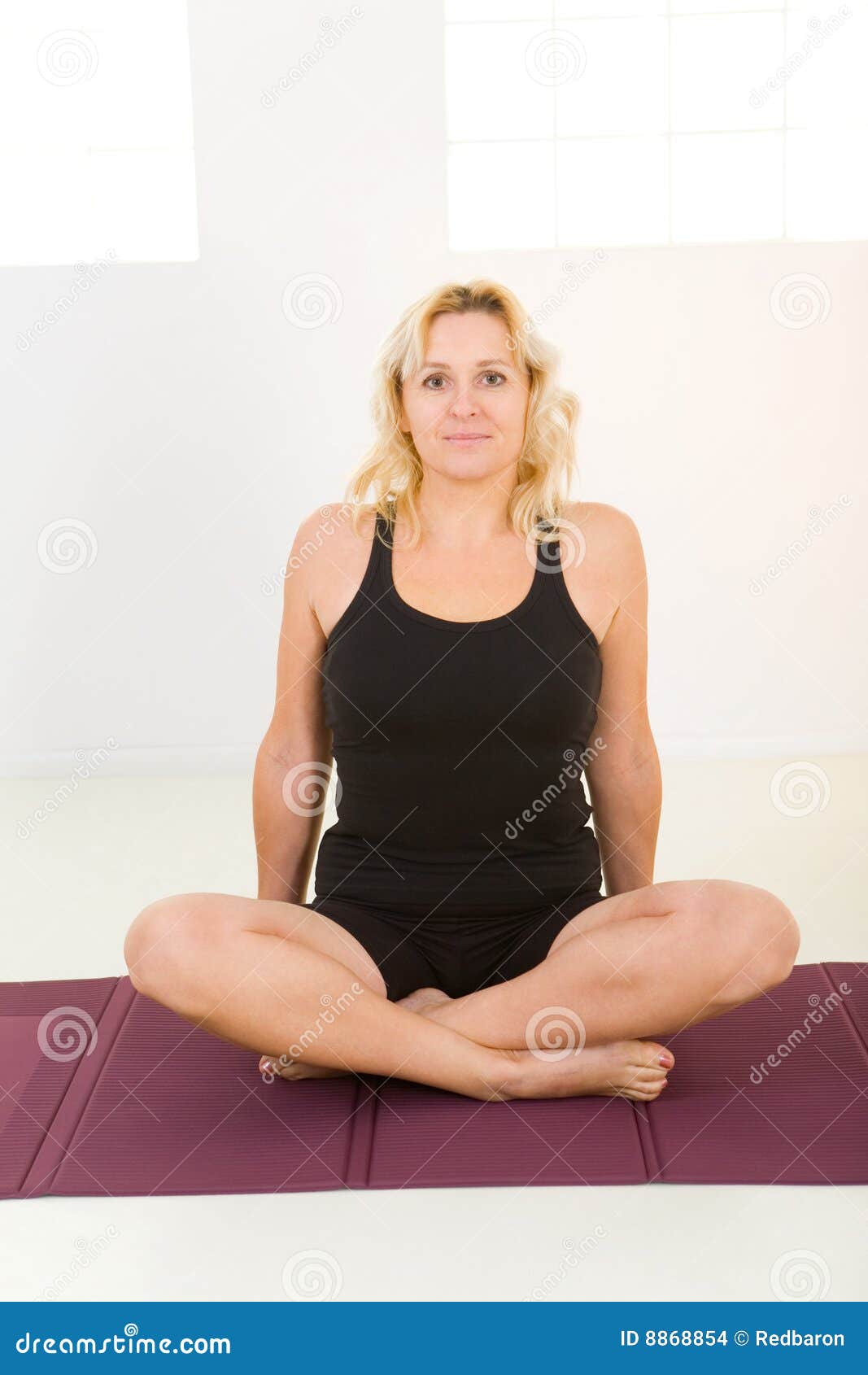 Women Sitting Cross-legged on Mat Stock Photo - Image of senior, ageing ...