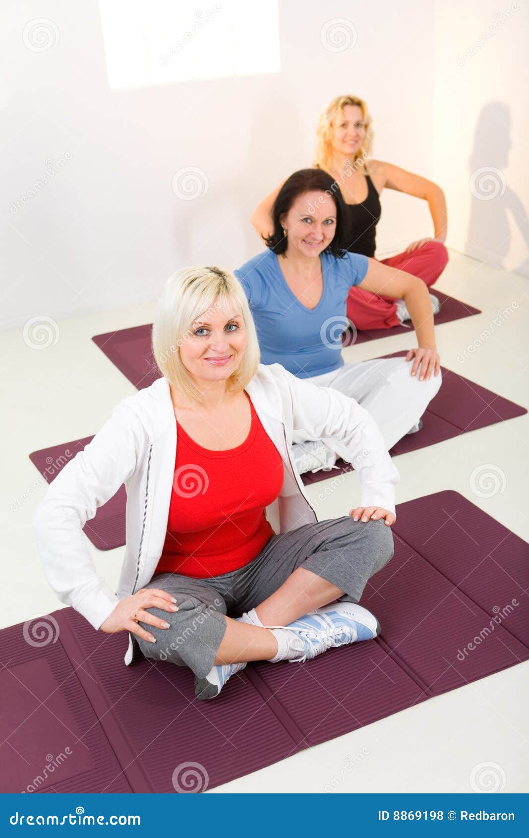 Women Sitting Cross-legged on Mat Stock Photo - Image of energy ...