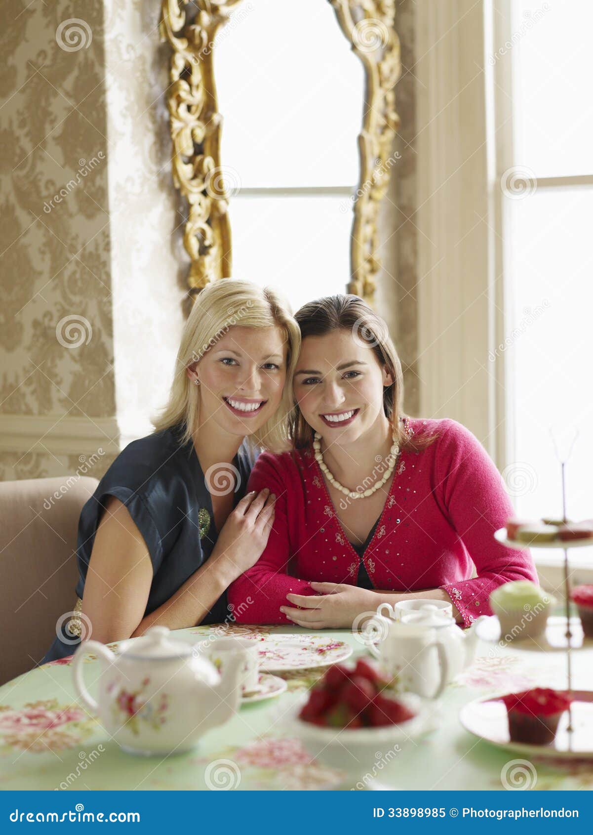 Women Sitting Dining Table stock image. Image of london - 33898985
