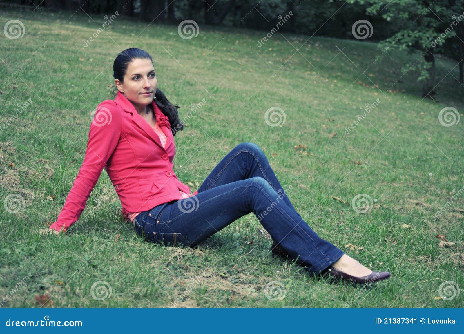 Women sitting on lawn stock image. Image of park, jacket - 21387341