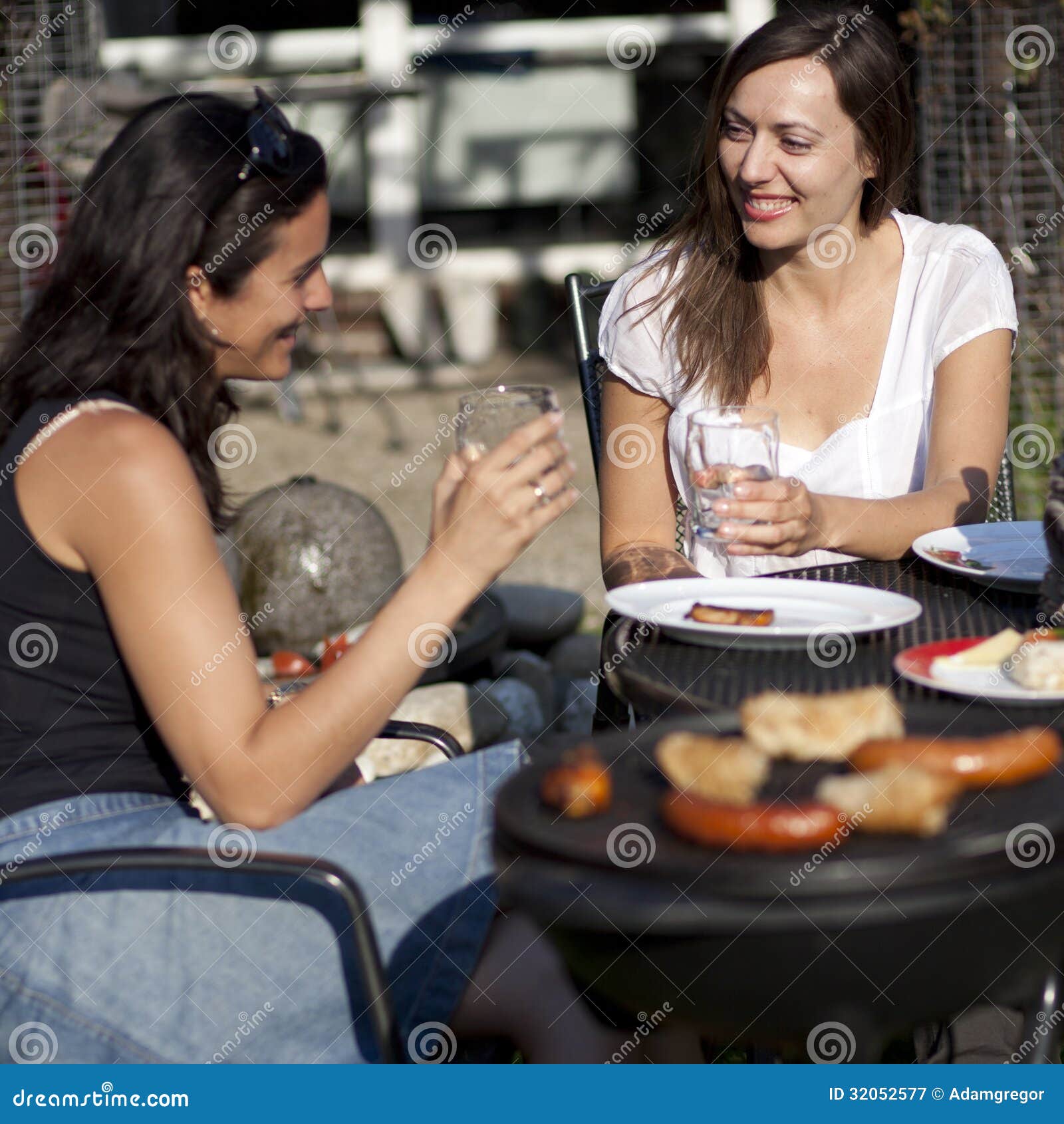 Women smiling during BBQ stock image. Image of person - 32052577