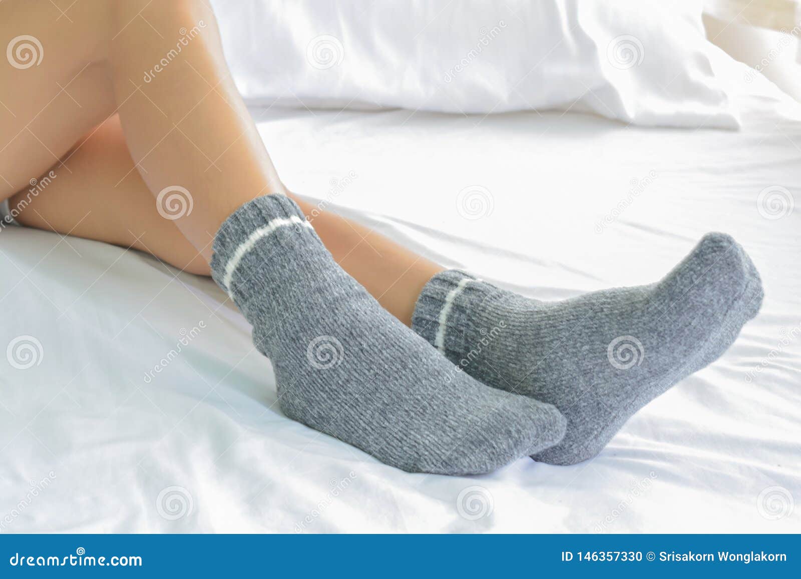 Women socks on bed stock photo. Image of relax, socks - 146357330