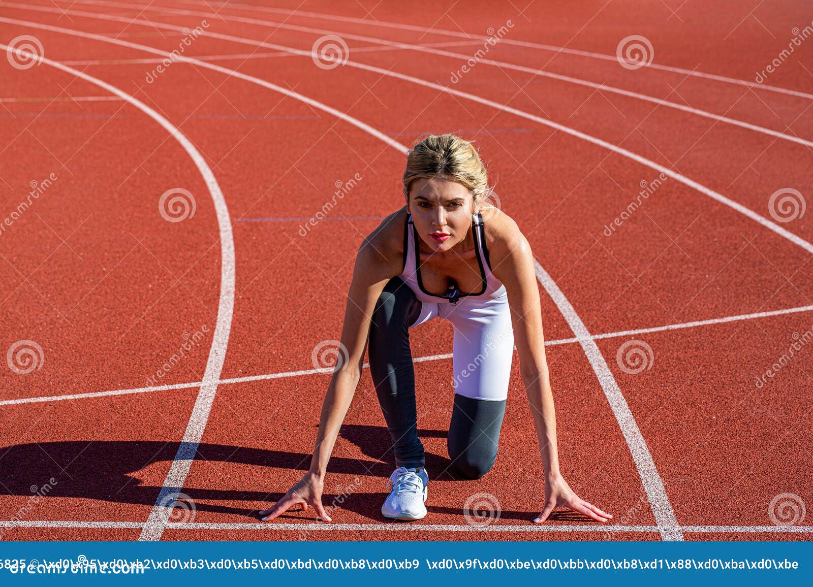 Women Sprinters At Starting Position Ready For Race On Racetrack Girl