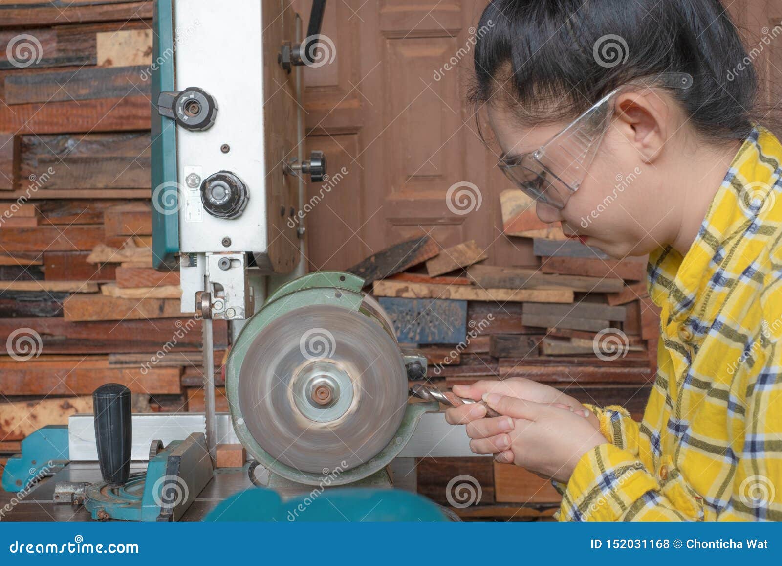 Women Standing is Sharpen Drill at a Work Bench with Whetstone Machine ...