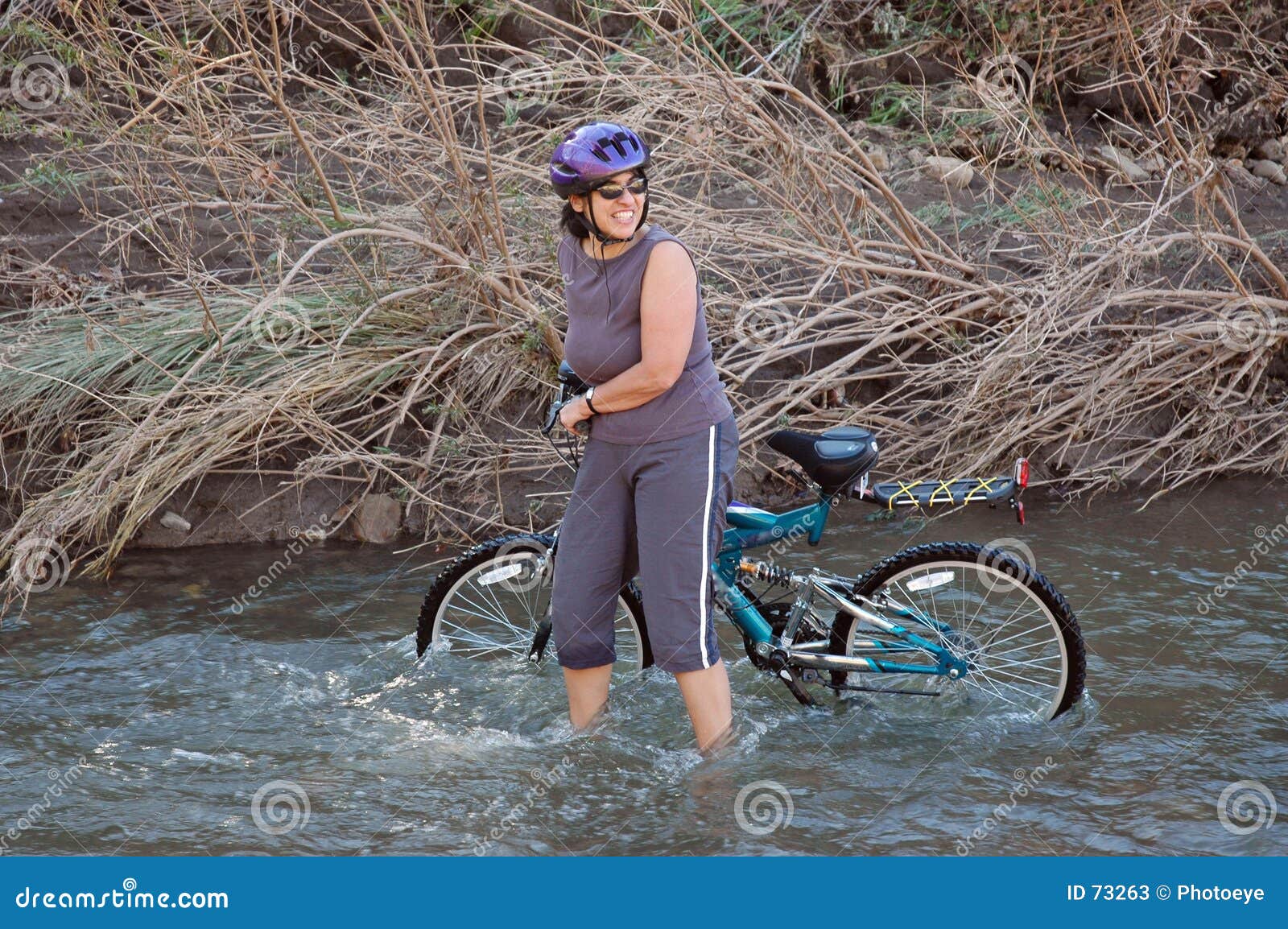 Women in stream with bike stock image. Image of health, river - 73263