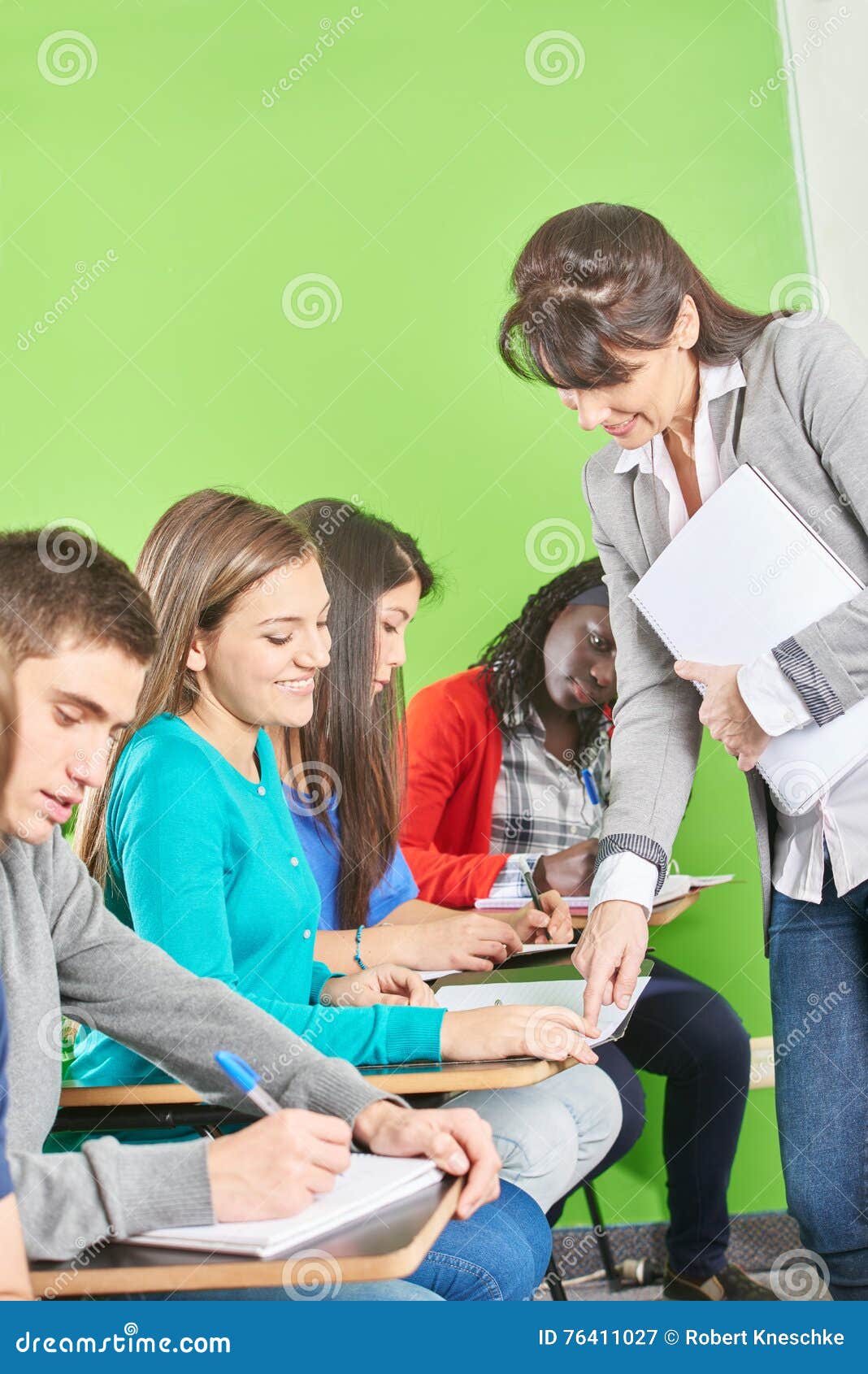 Women supervises a test stock image. Image of teenager - 76411027