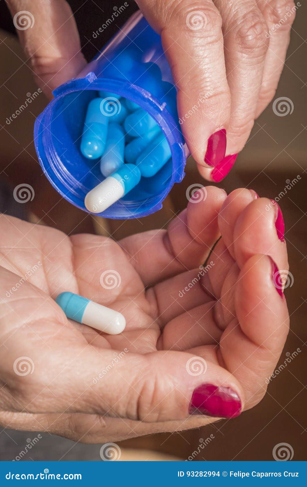 Women Take White and Blue Capsule with Left Hand Stock Photo - Image of ...