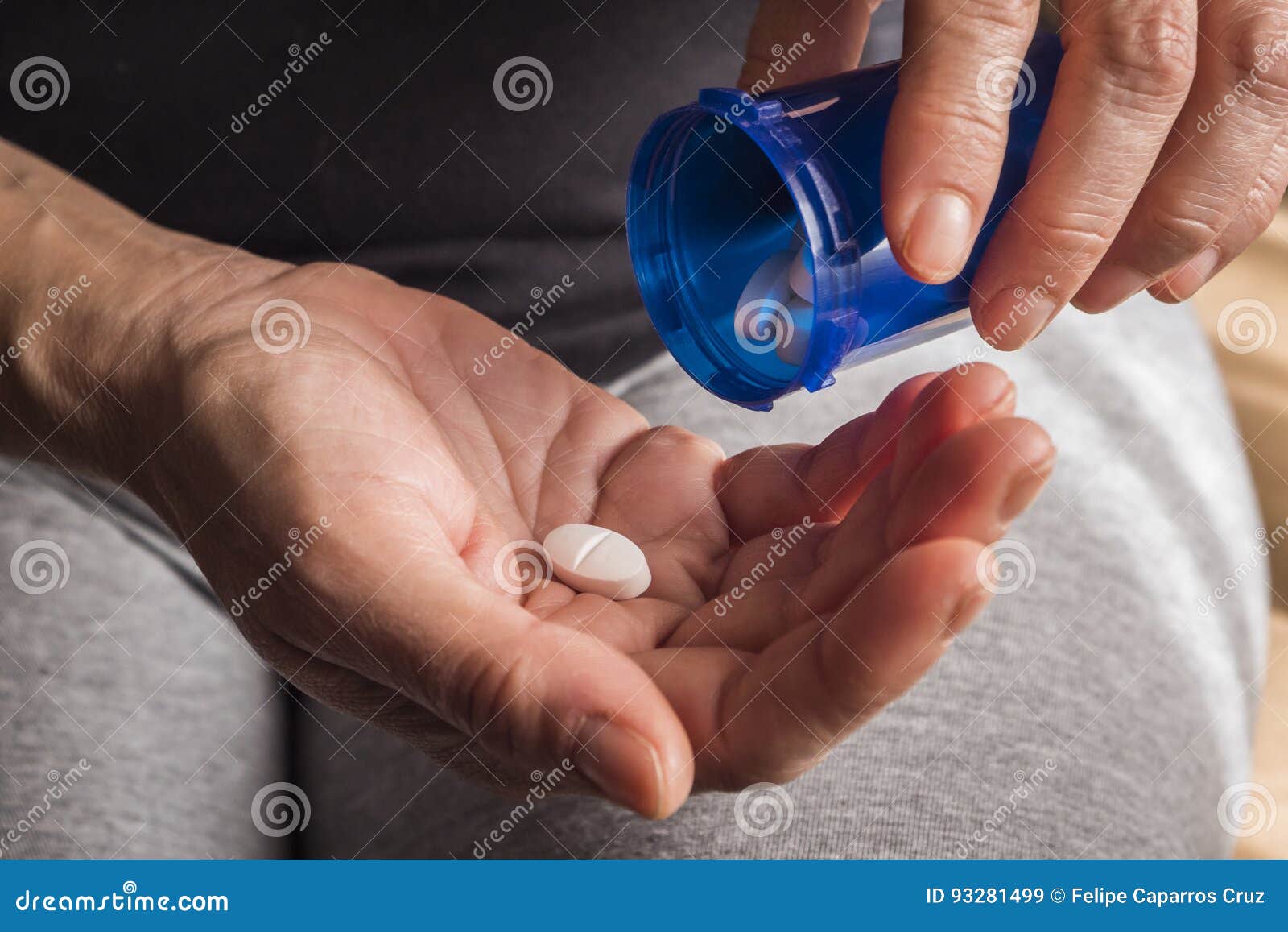 Women Take White Capsule with Left Hand from a Blue Transparent Stock ...