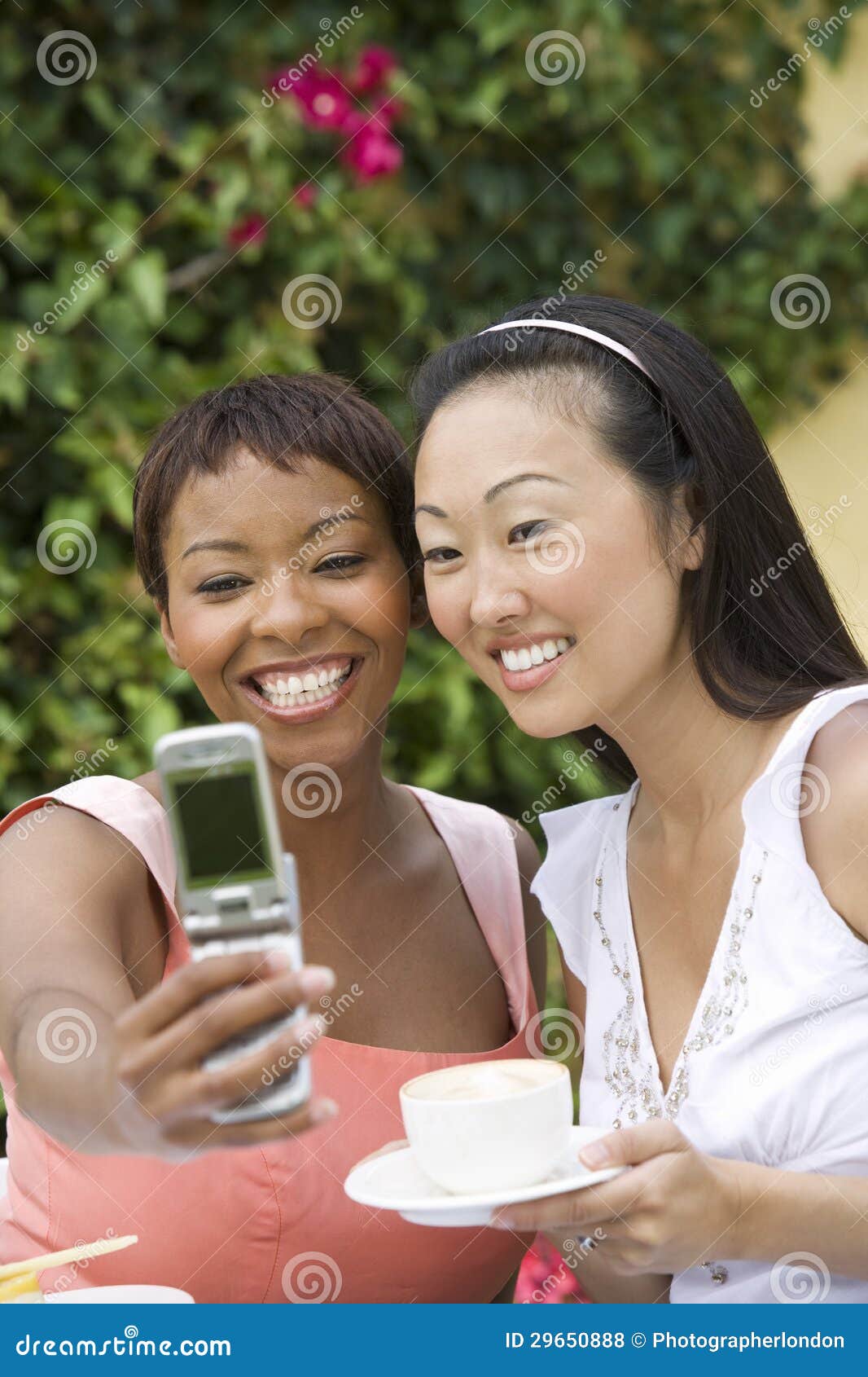 Women Taking Self-Portrait through Cell Phone Stock Photo - Image of ...