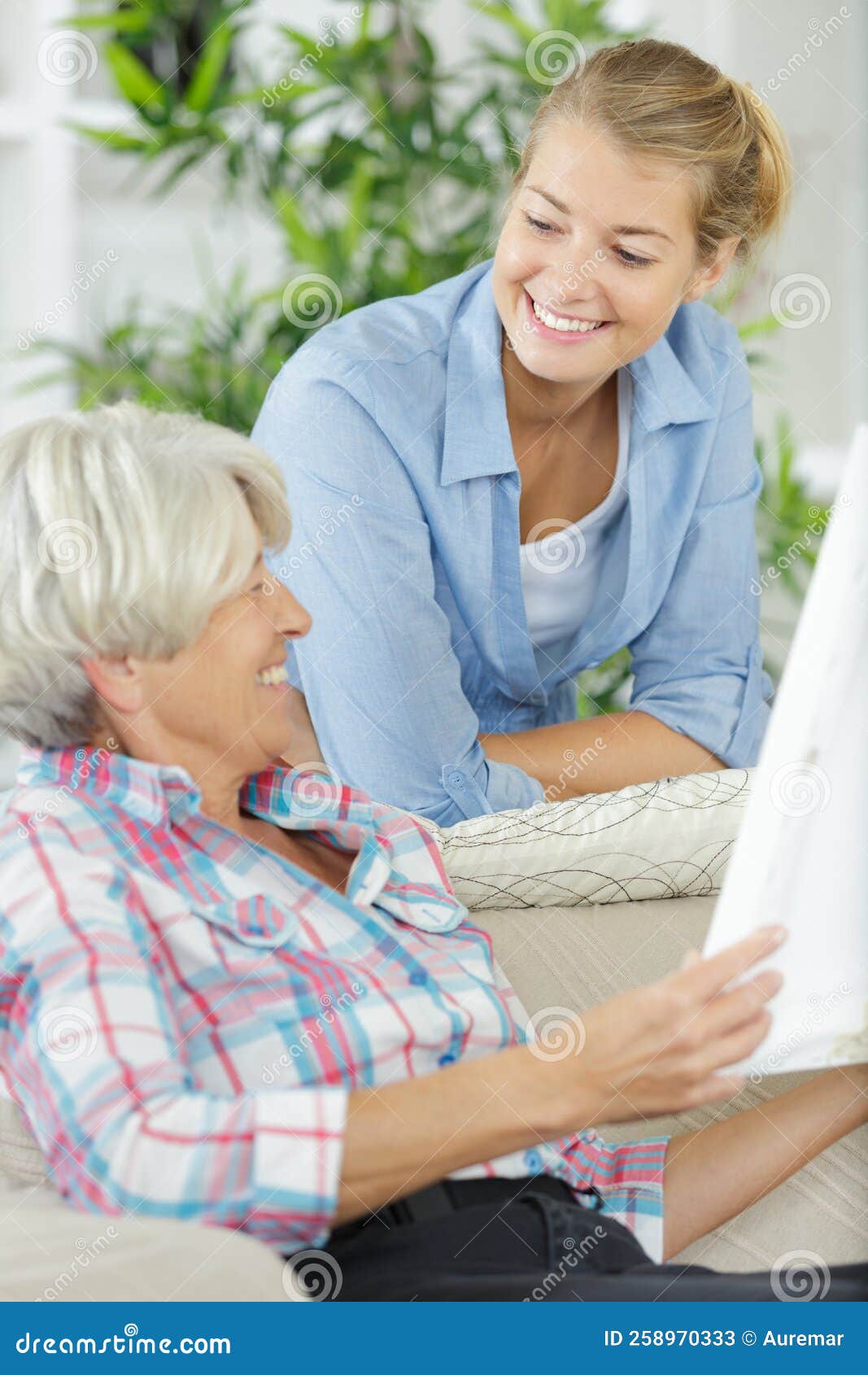Women talking on couch stock image. Image of concentration - 258970333