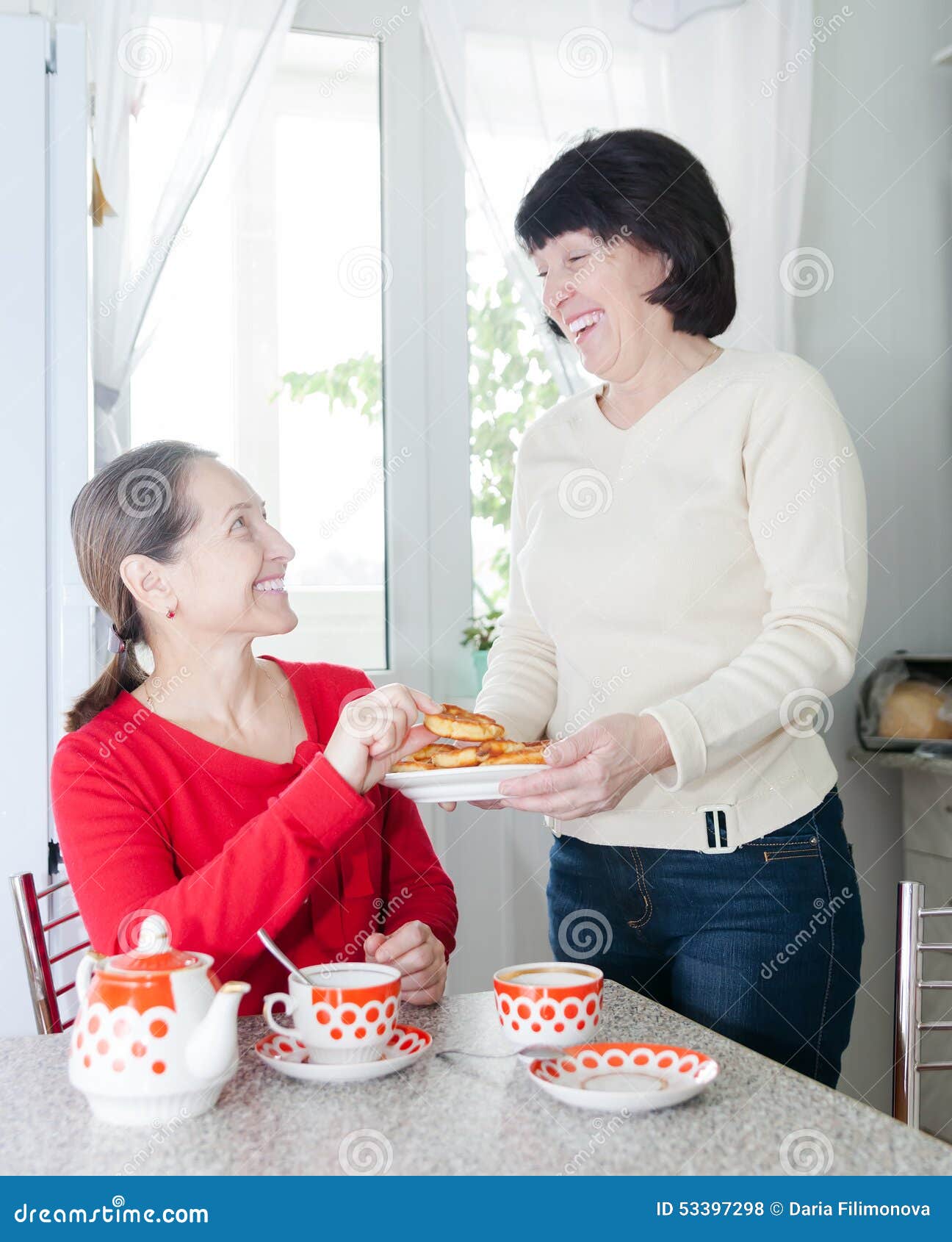 Women Talking Over Coffee in Kitchen. Stock Photo - Image of friends ...