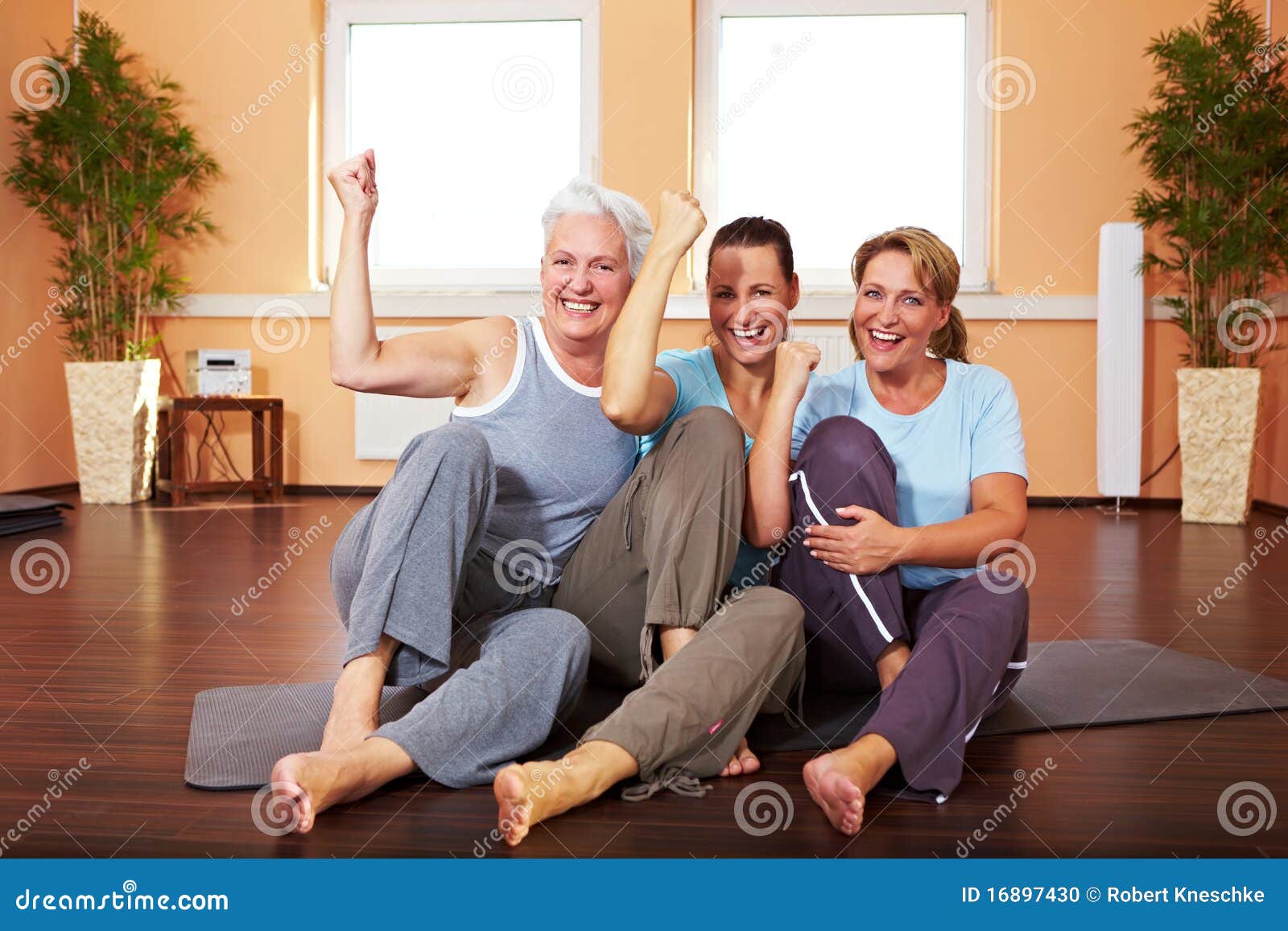 Women team showing muscles stock photo. Image of fist - 16897430